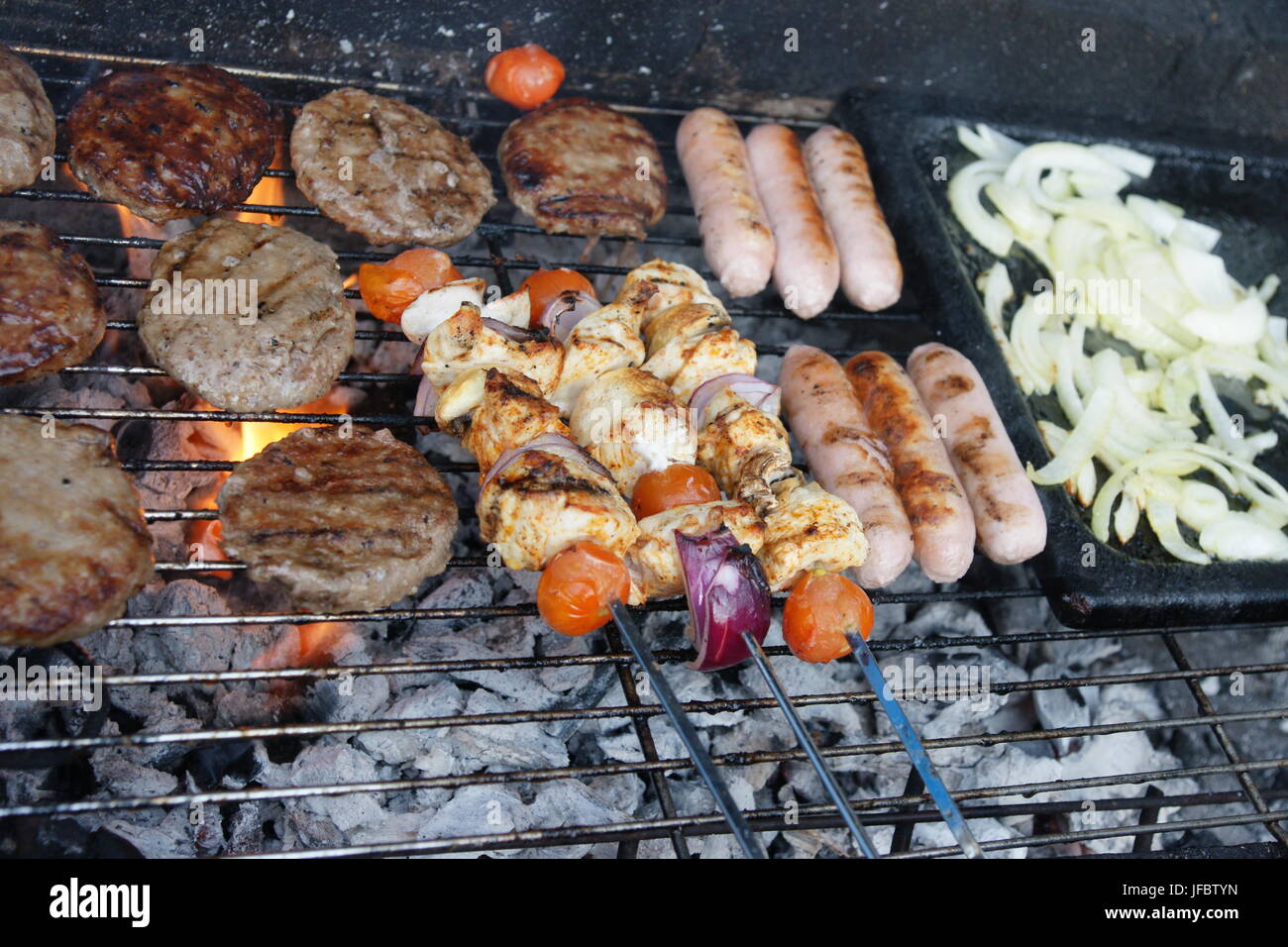 barbecue grill full, fresh barbecue food Stock Photo - Alamy