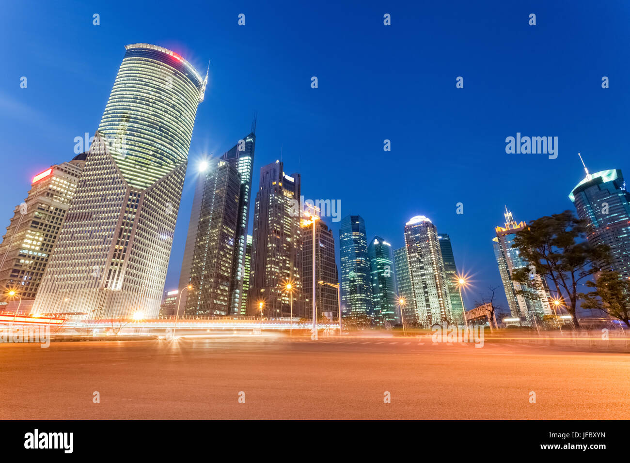 modern buildings with city road at night Stock Photo - Alamy