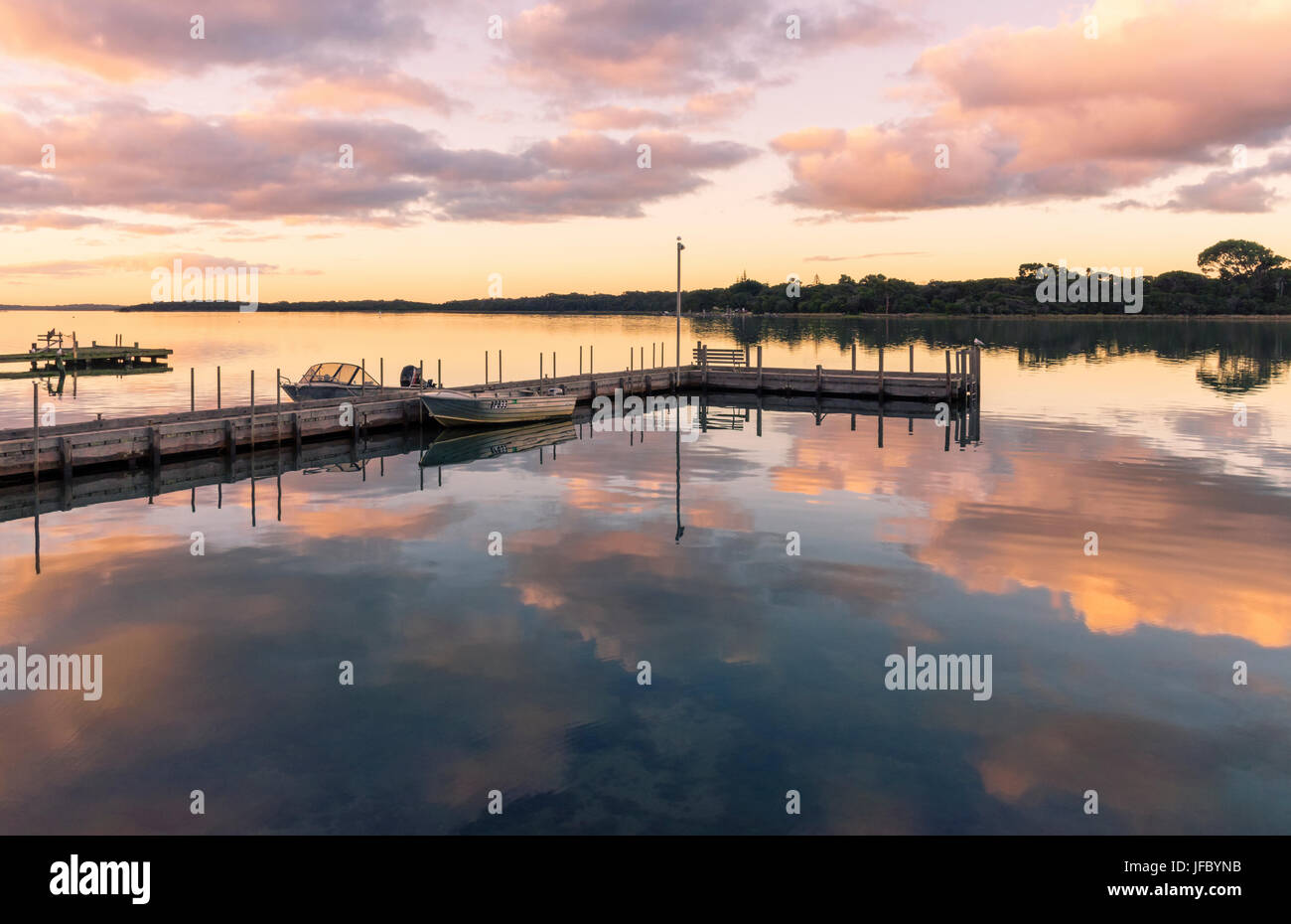 Sunset over a jetty on Hardy Inlet, Augusta, Western Australia Stock ...