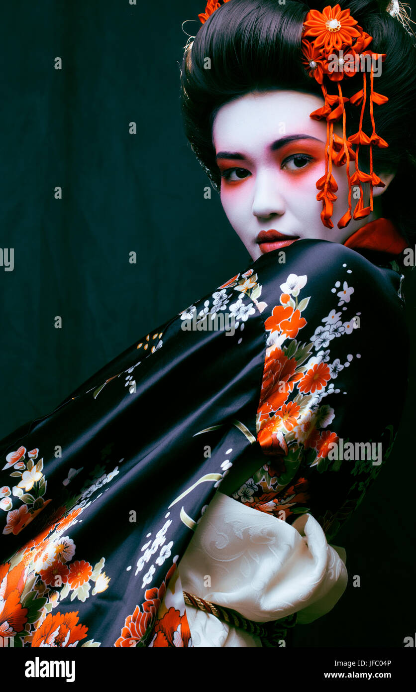 young pretty geisha in kimono with sakura and decoration Stock Photo ...