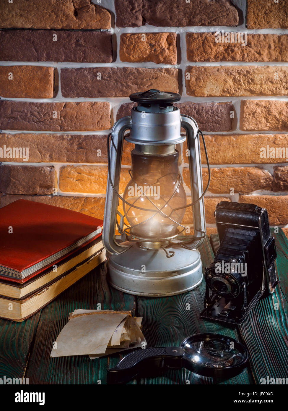 Antique book and oil lamp still life hi-res stock photography and ...