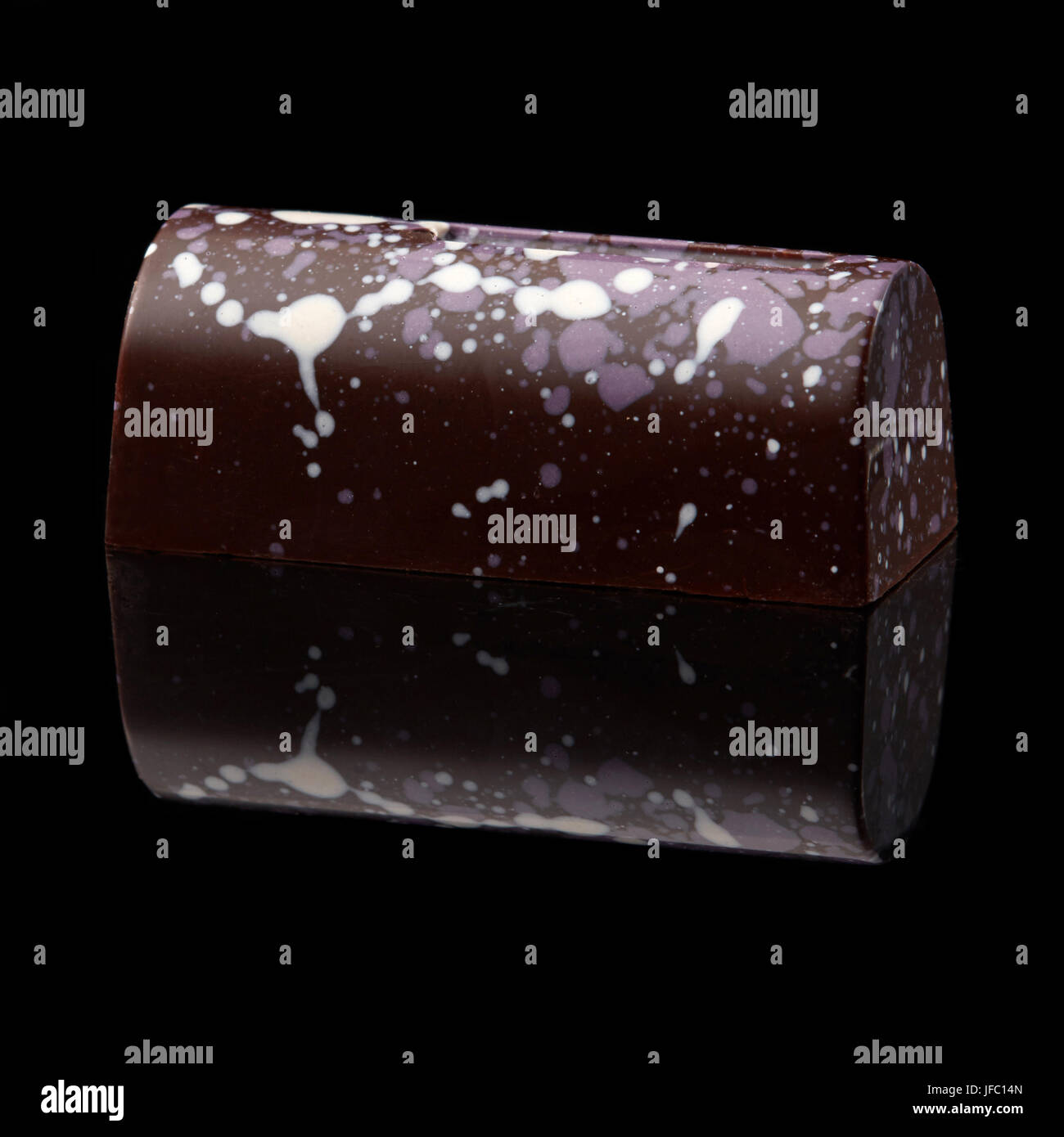 chocolate candy on black background Stock Photo - Alamy