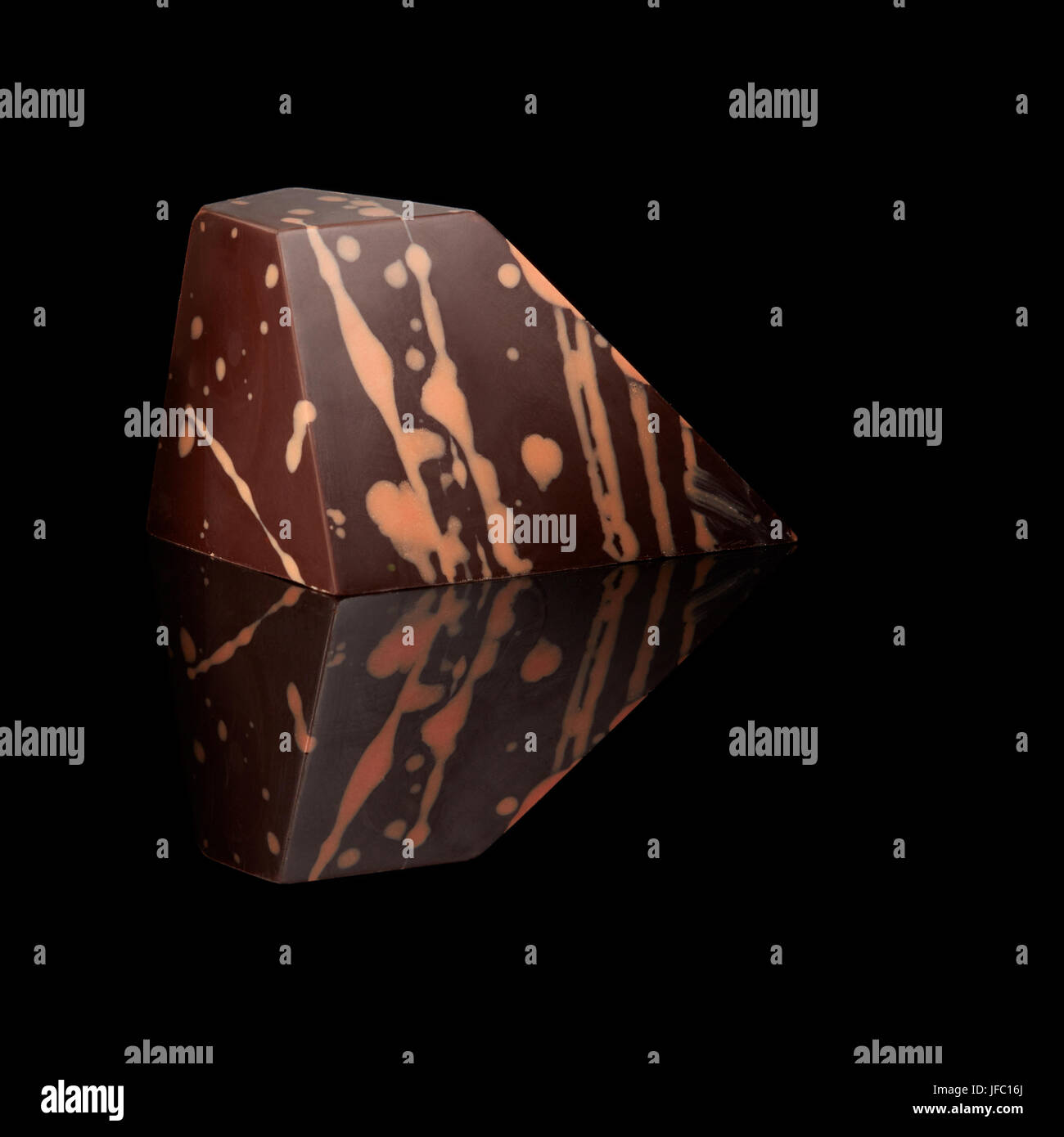 chocolate candy on black background Stock Photo - Alamy
