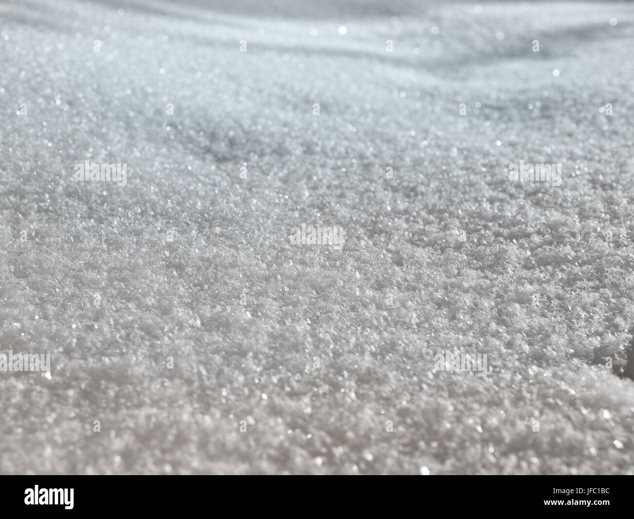 texture of white snow sparkling in the sun macro Stock Photo - Alamy