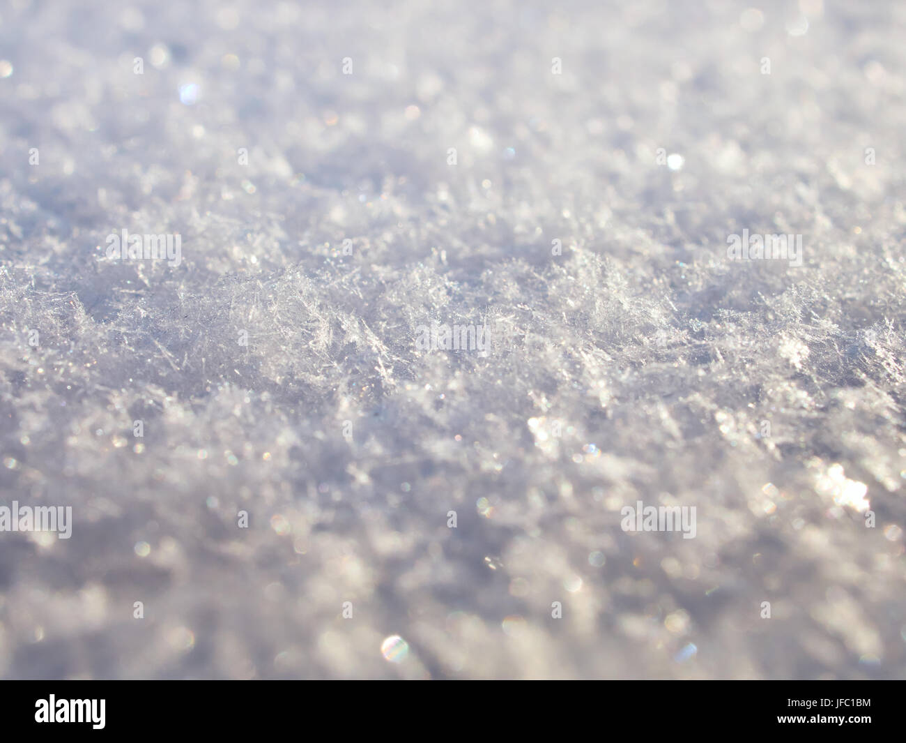 texture of white snow sparkling in the sun macro Stock Photo - Alamy