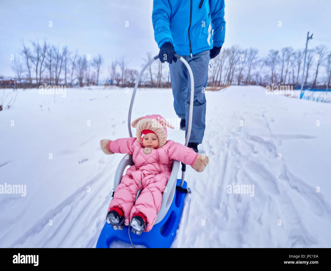 Dragging sled hi-res stock photography and images - Alamy