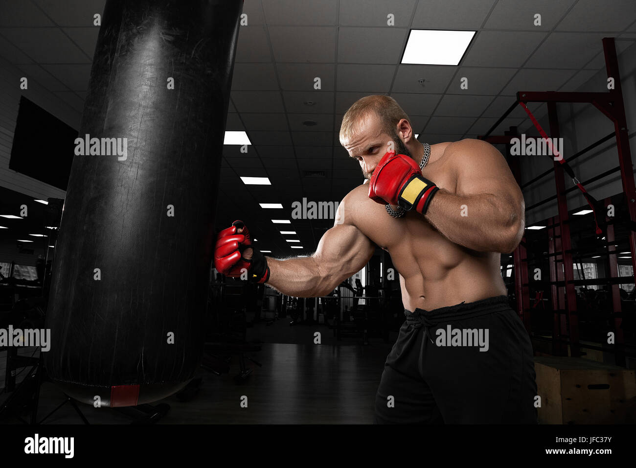 Strong muscular man boxing at the gym Stock Photo - Alamy