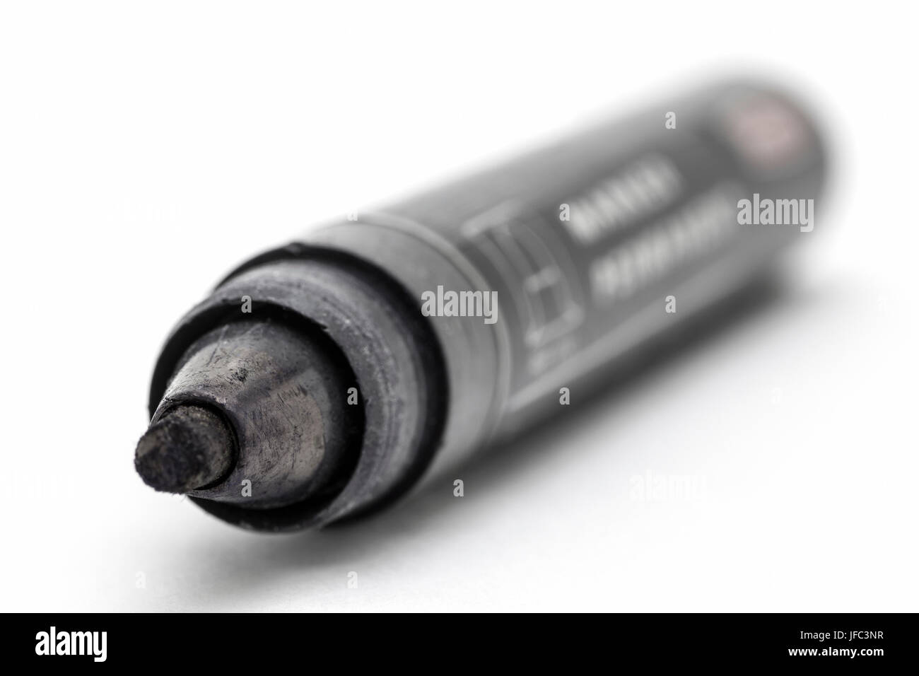Thick black marker closeup on a white background Stock Photo - Alamy