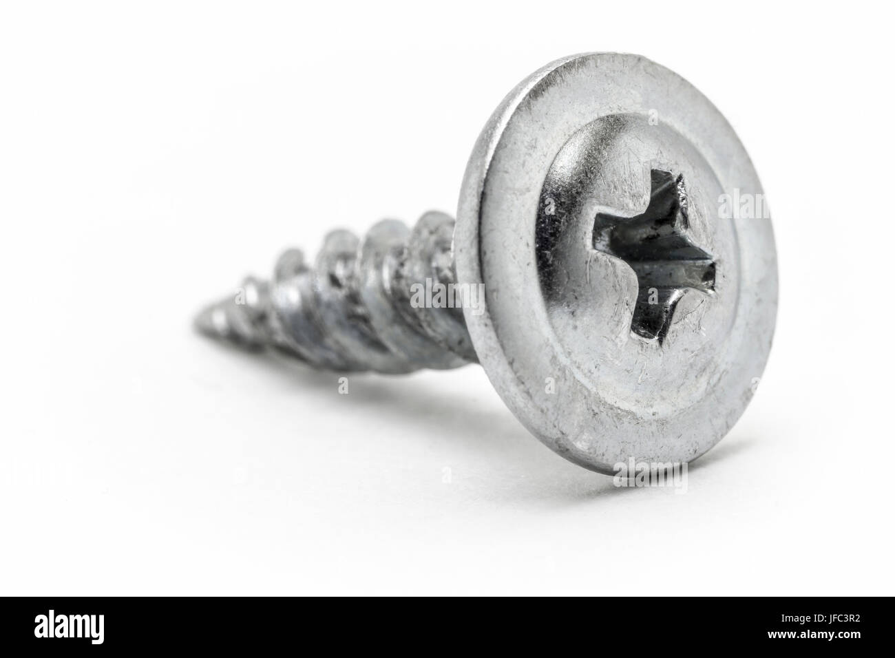 Metal construction screw closeup on a white background Stock Photo - Alamy