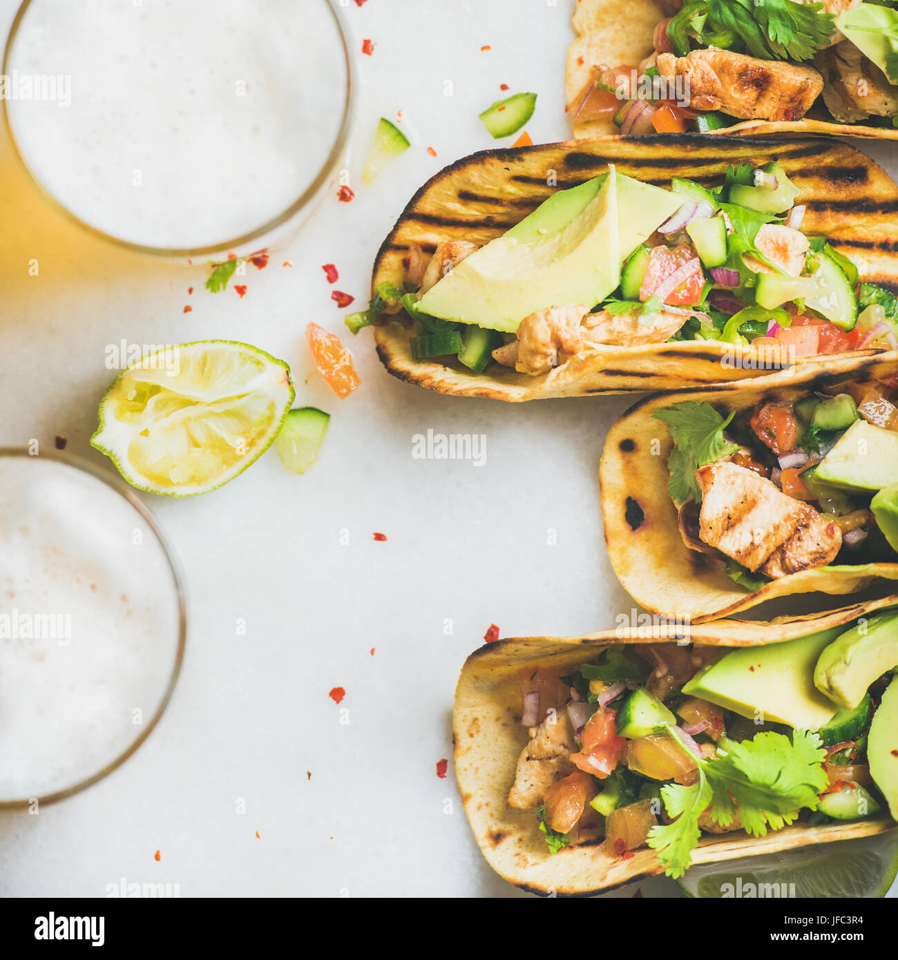 Healthy corn tortillas with chicken, vegetables, limes, square crop ...