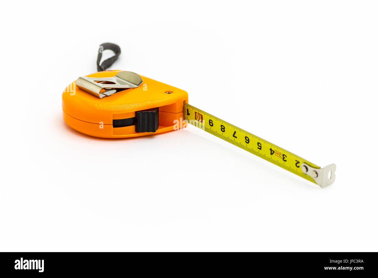 Orange construction tape measure closeup on white background Stock ...