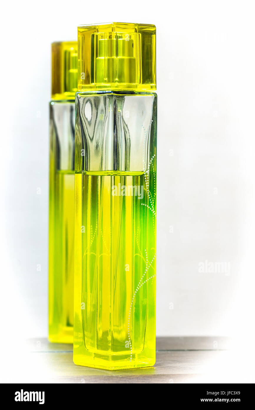 Bottle of perfume closeup on a white background Stock Photo - Alamy