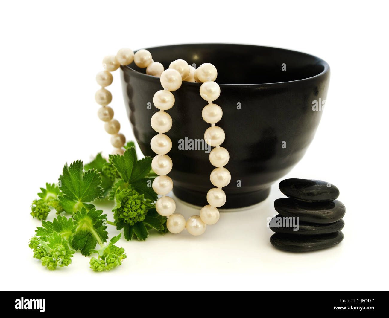Pearl Beads, Zen Stones and Green Herb Stock Photo - Alamy