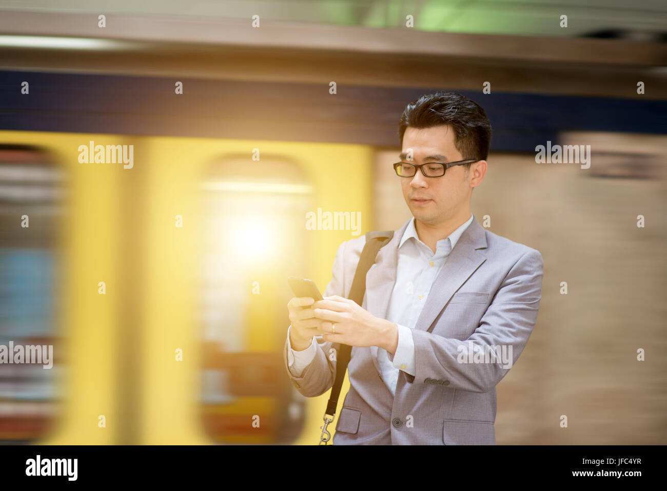 Male texting subway hi-res stock photography and images - Alamy