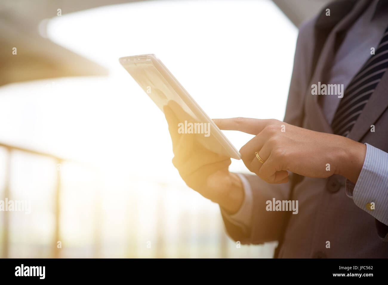 Business people hand using digital tablet pc at railway station, with ...