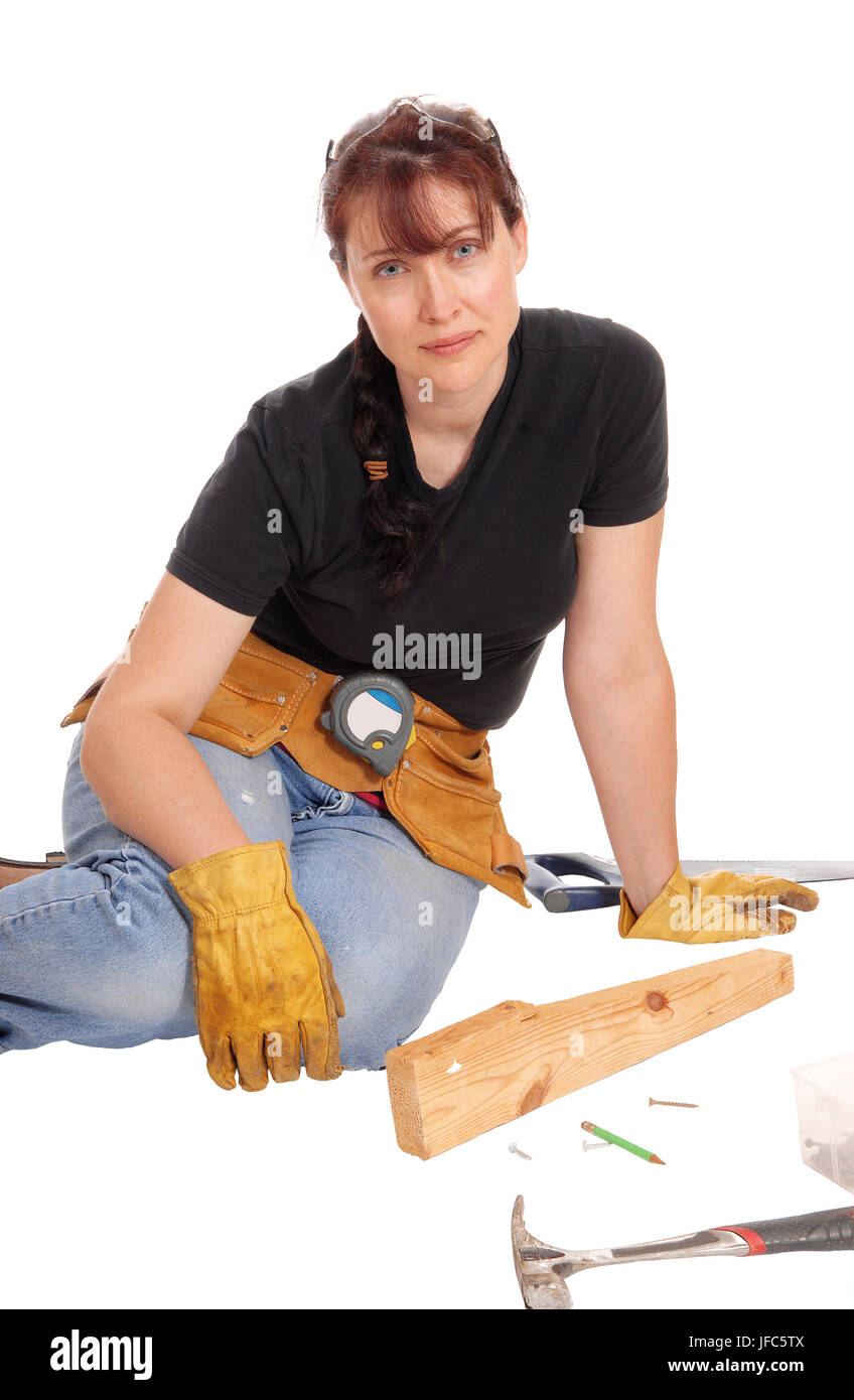 Woman sitting and working with tools Stock Photo - Alamy