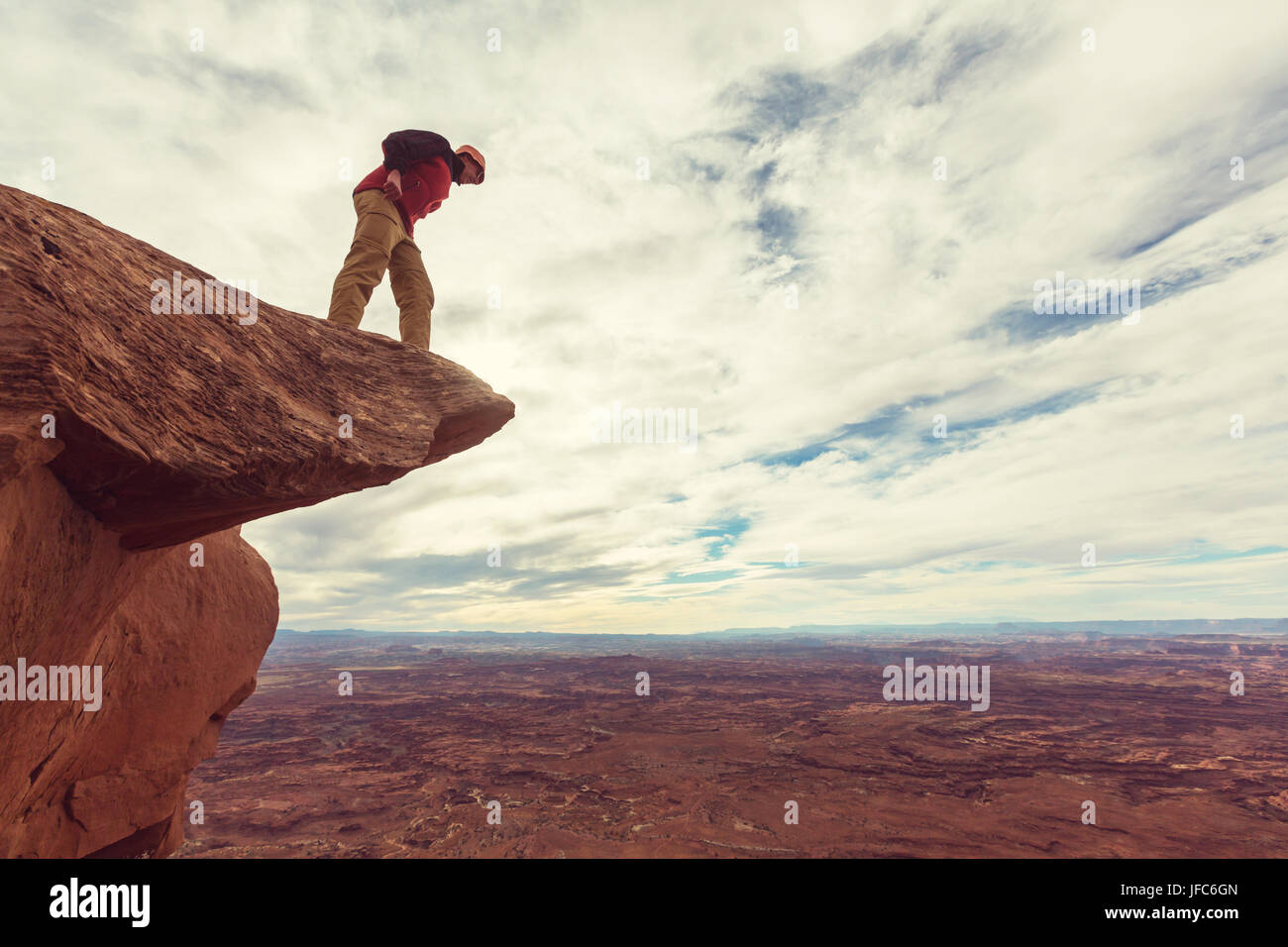 Man on the cliff Stock Photo - Alamy