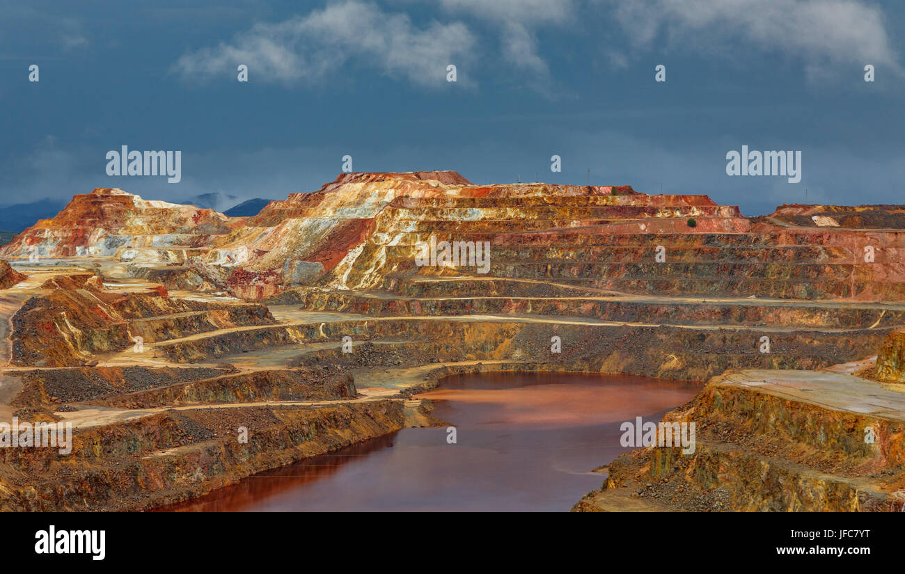 Detailed view of copper mine open pit in Rio Tinto, cloudy day, Spain ...