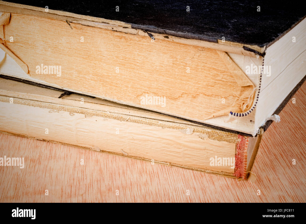 Stack of old books with damaged binding Stock Photo - Alamy