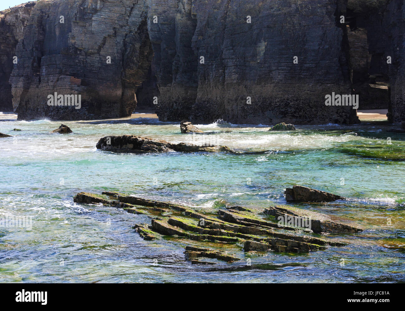 Natural arches on beach Stock Photo - Alamy