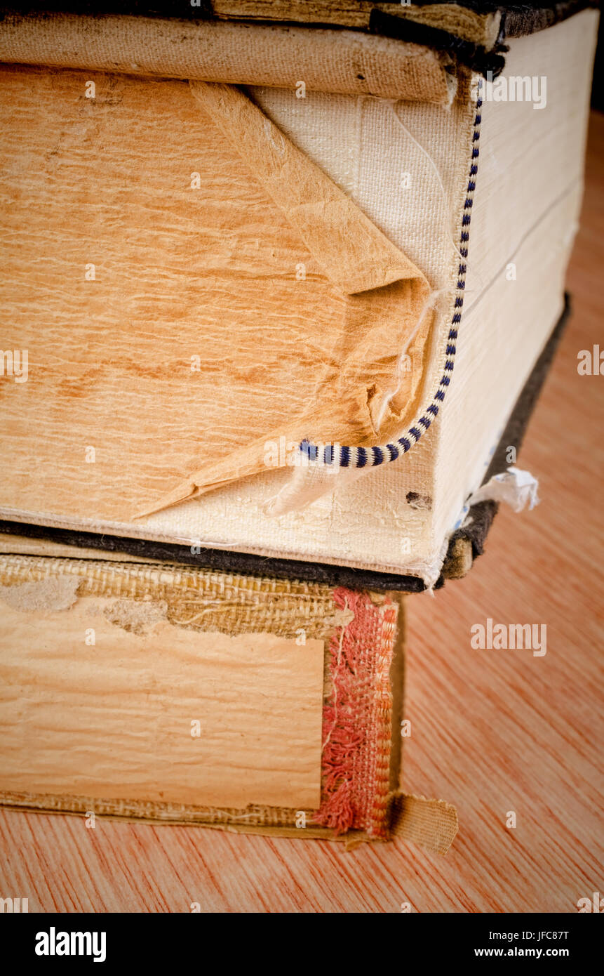 Stack of old books with damaged binding Stock Photo - Alamy