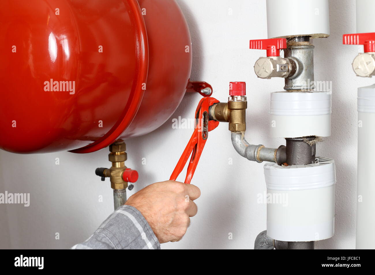 worker is mounting a pipe Stock Photo - Alamy