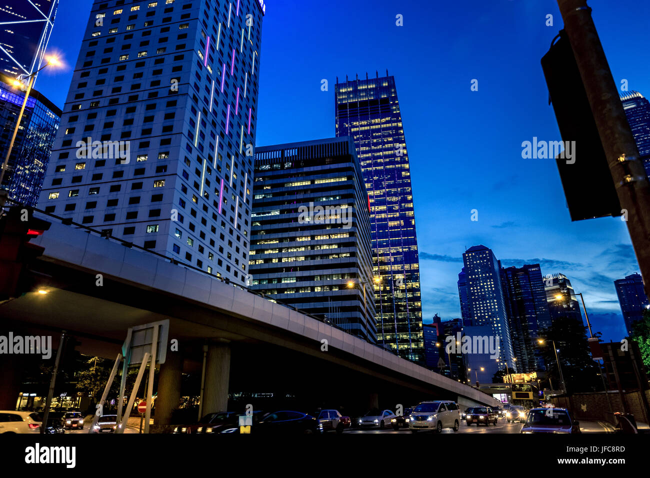 Commercial buildings at night in Hong Kong Stock Photo - Alamy