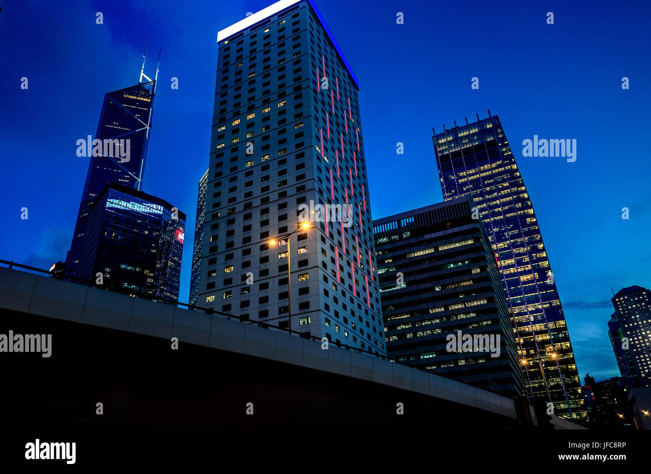 Commercial buildings at night in Hong Kong Stock Photo - Alamy