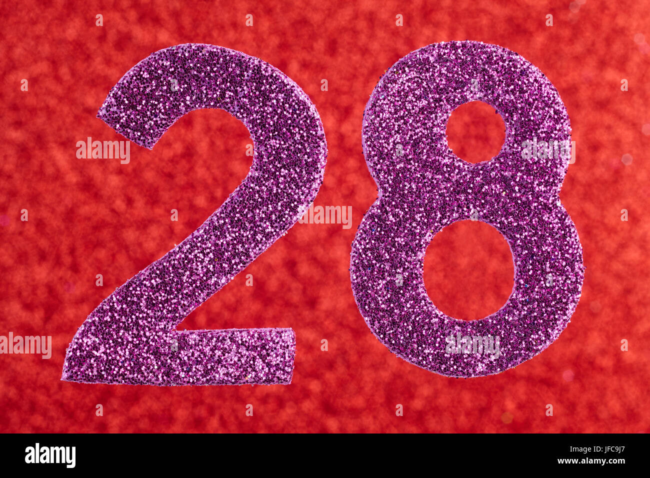 Number twenty-eight purple color over a red background. Anniversary ...