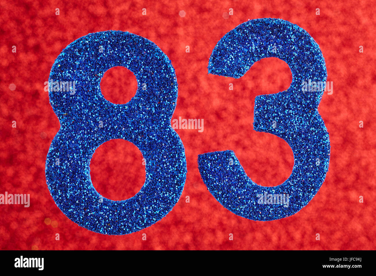 Number eighty-three blue color over a red background. Anniversary ...