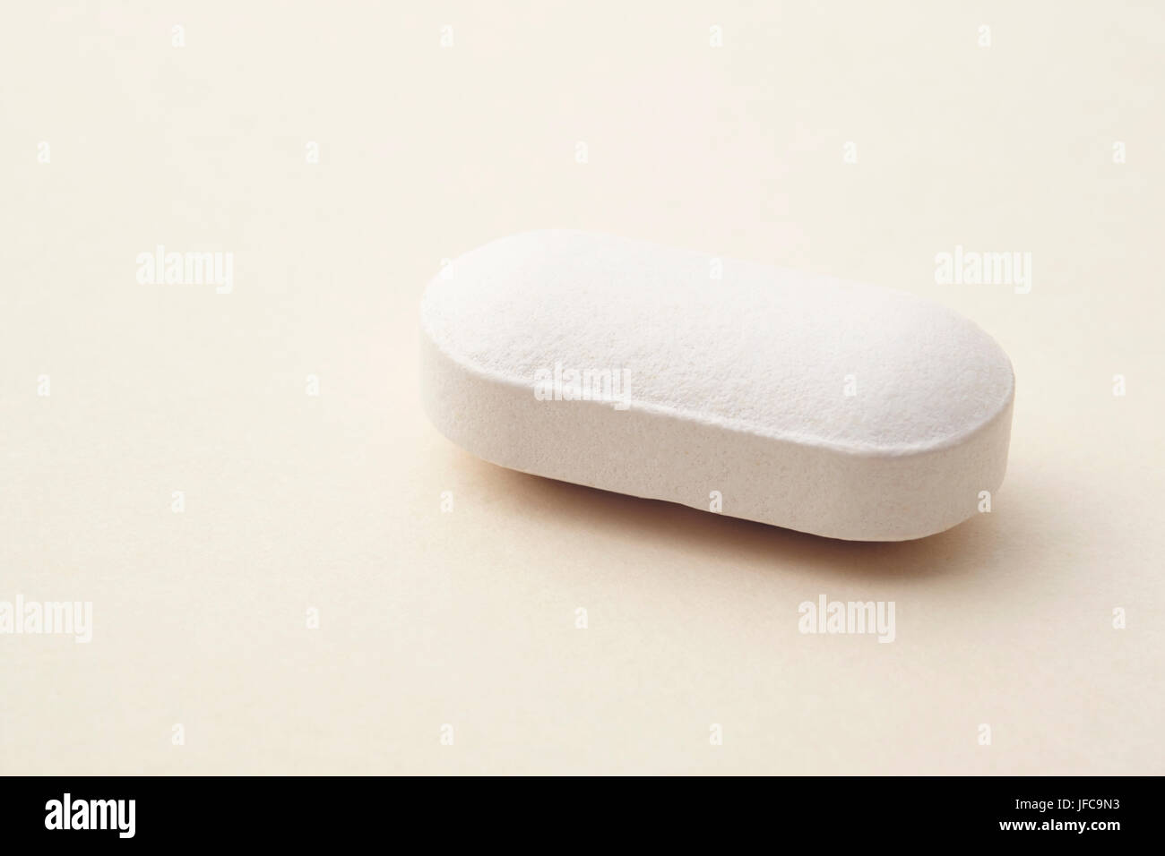 Pill over a beige background. Medicament treatment. Health care photo ...