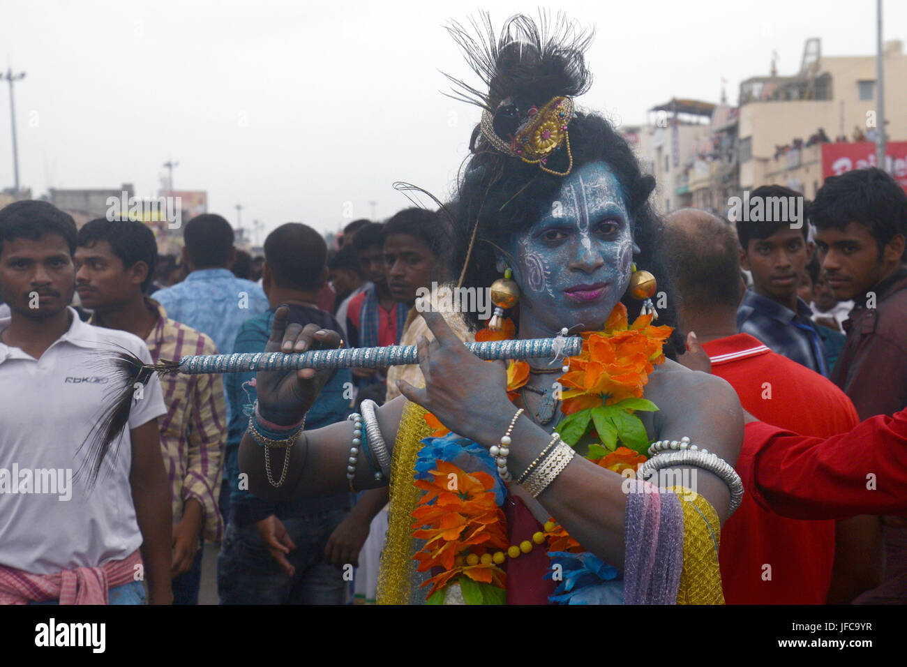 Hindu man in Lord Krishna attire joins the Ratha Yatra or Car Festival ...
