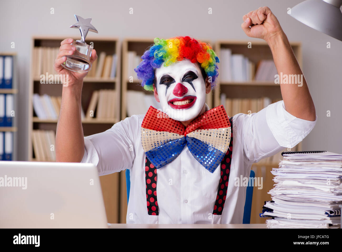 Clown businessman working in the office Stock Photo - Alamy