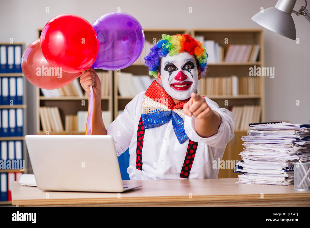 Clown businessman working in the office Stock Photo - Alamy