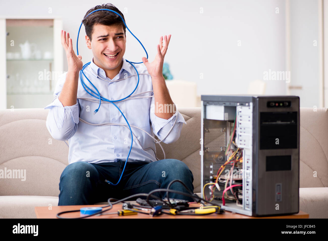 Frustrated man with broken pc computer Stock Photo - Alamy
