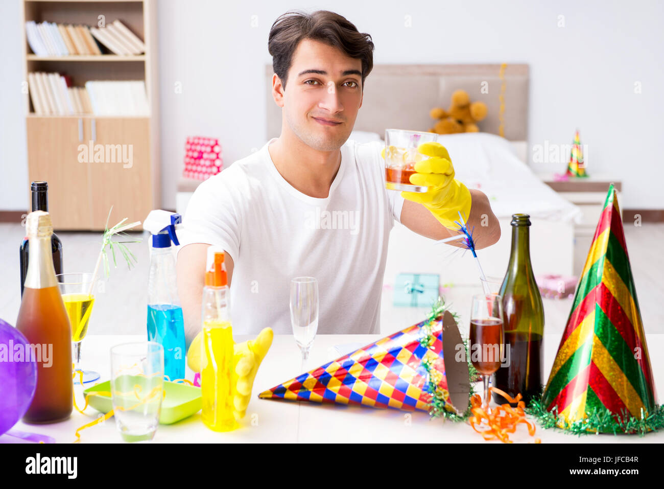 Man at home after heavy partying Stock Photo - Alamy
