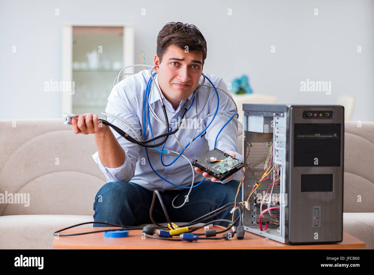 Frustrated man with broken pc computer Stock Photo - Alamy