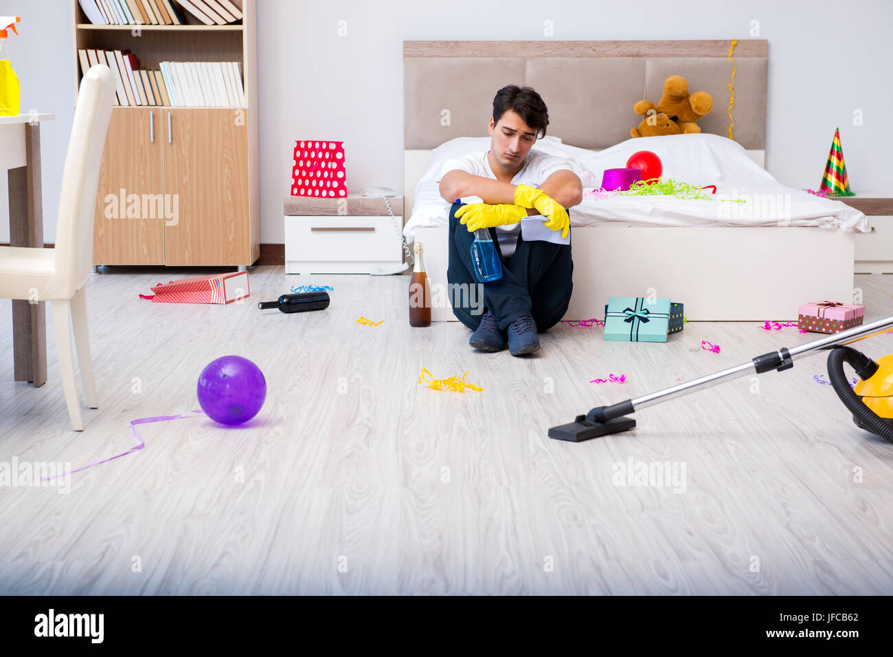 Man at home after heavy partying Stock Photo - Alamy