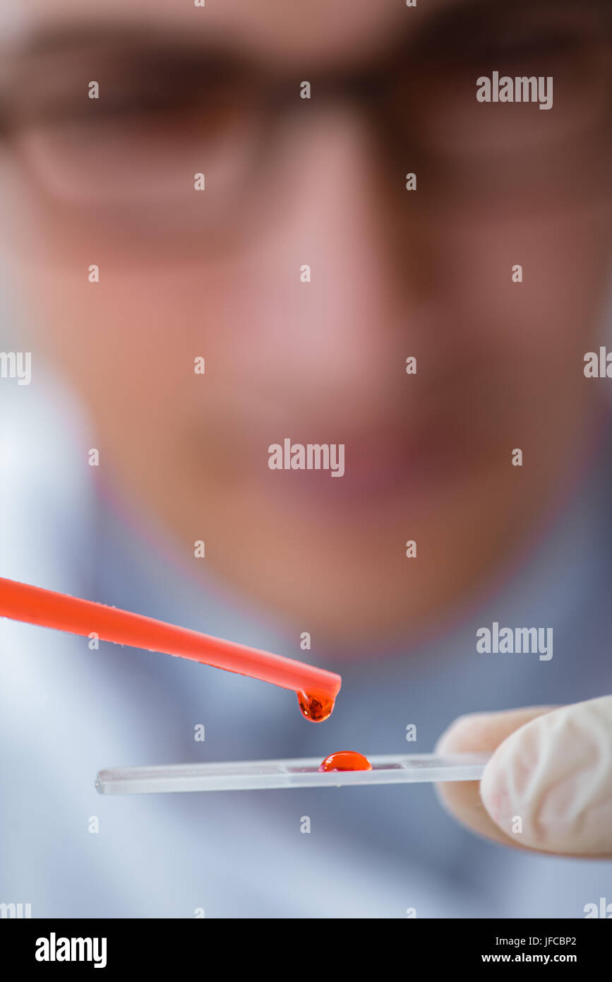 Young doctor doing the blood test Stock Photo - Alamy