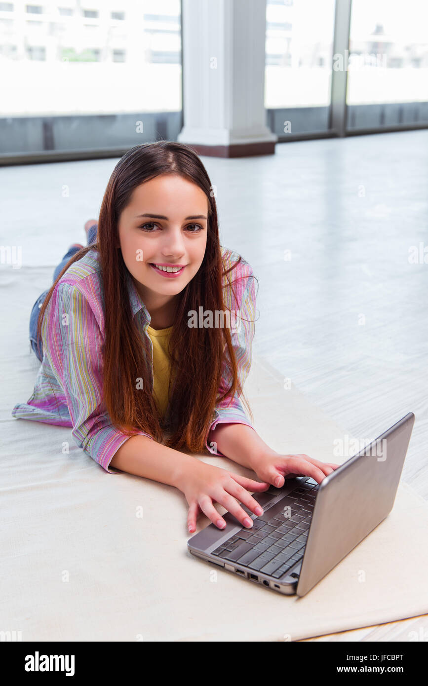 Young girl surfing internet on laptop Stock Photo - Alamy