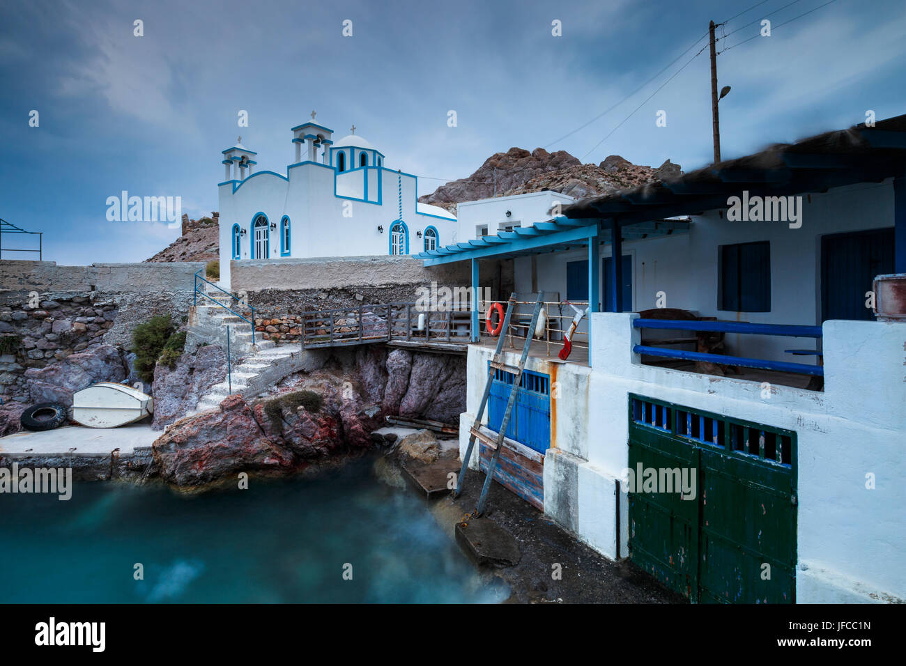 View of boat houses in Firopotamos fishing village on Milos island in ...