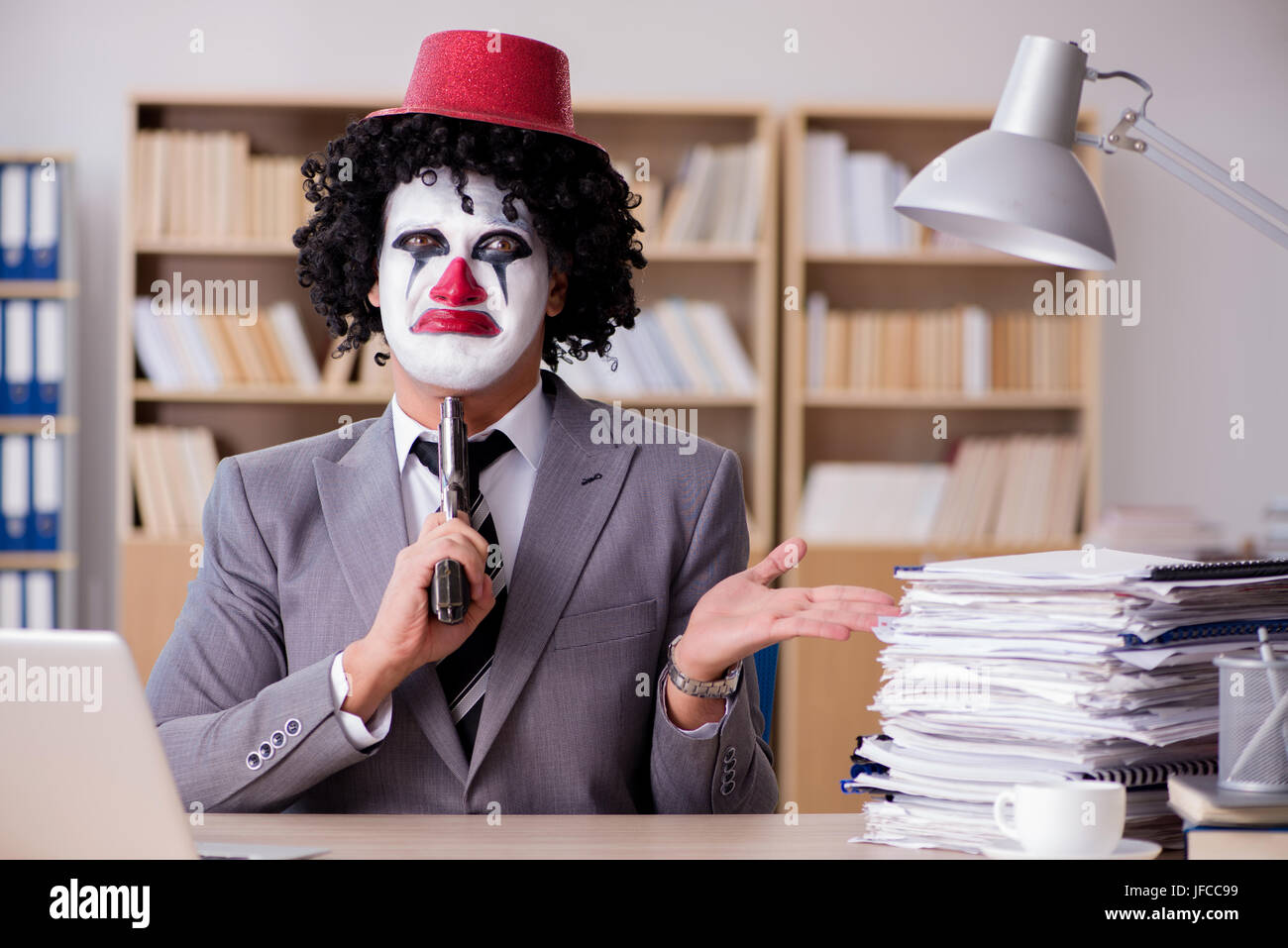 Clown businessman working in the office Stock Photo - Alamy