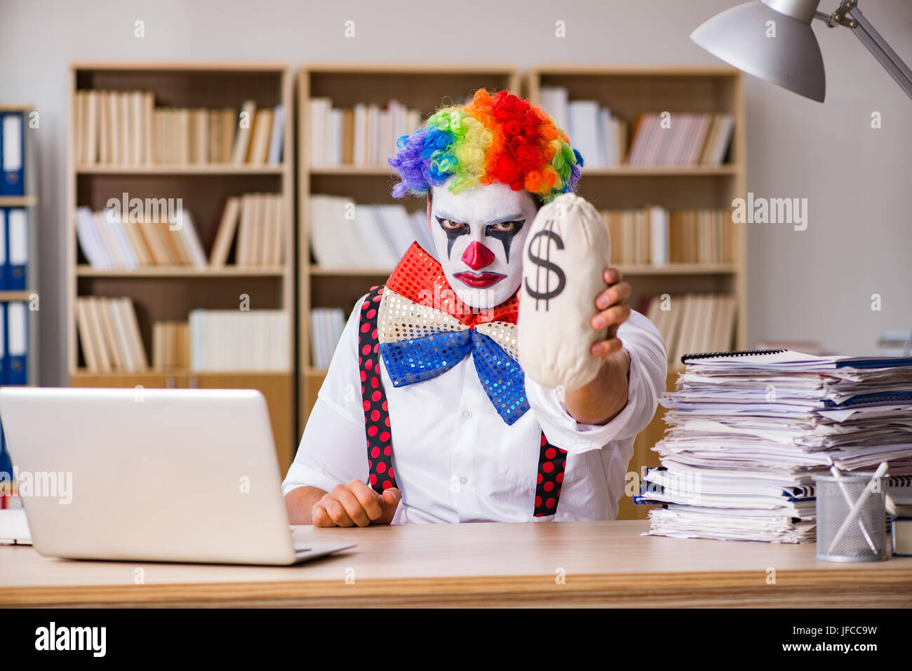 Clown businessman working in the office Stock Photo - Alamy