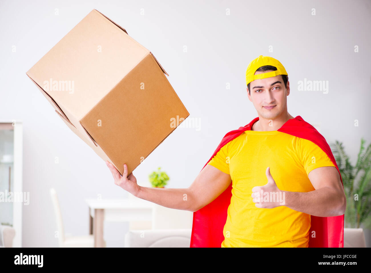 Superhero delivery guy with box Stock Photo - Alamy