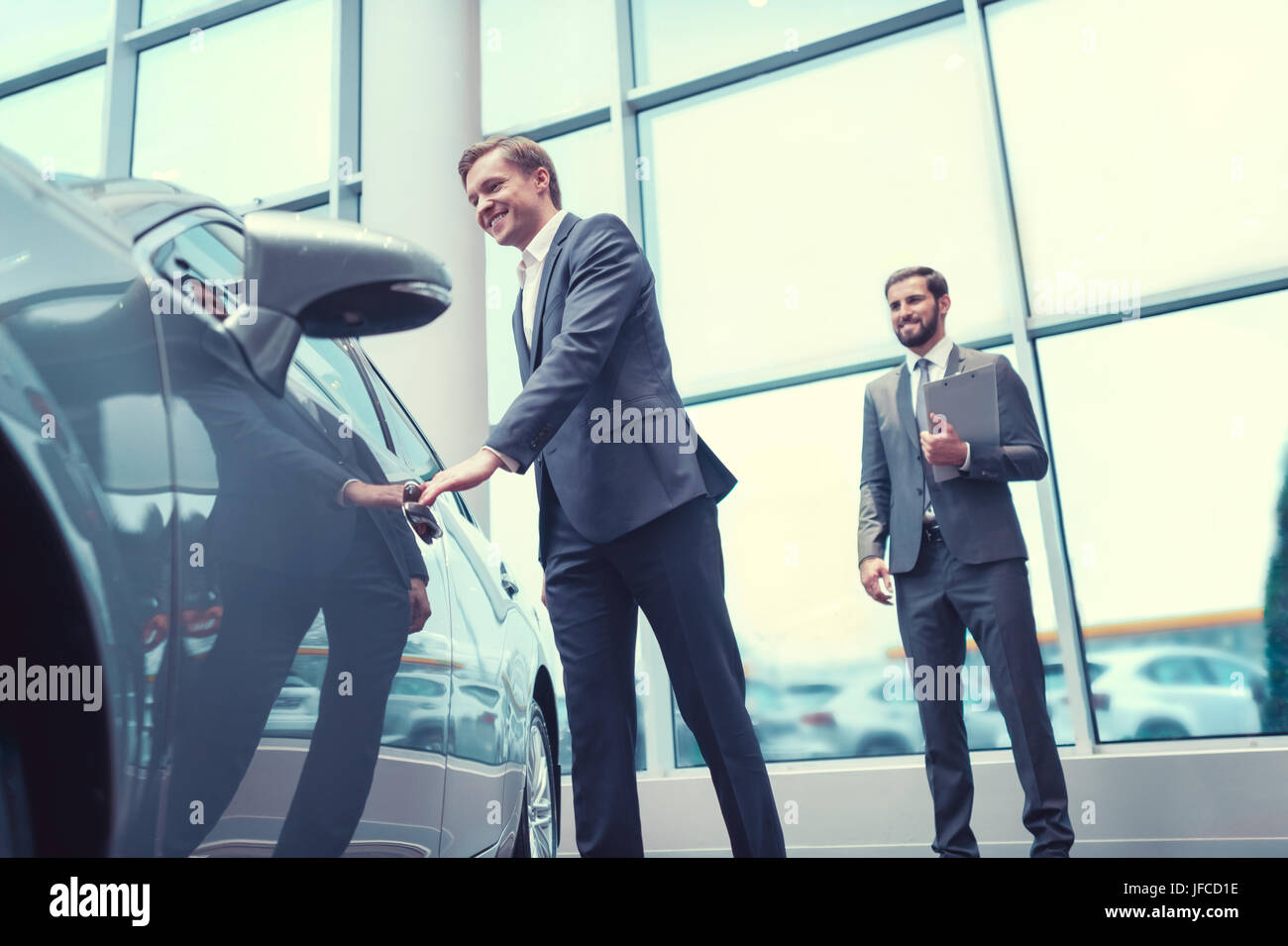 Manager in showroom Stock Photo - Alamy