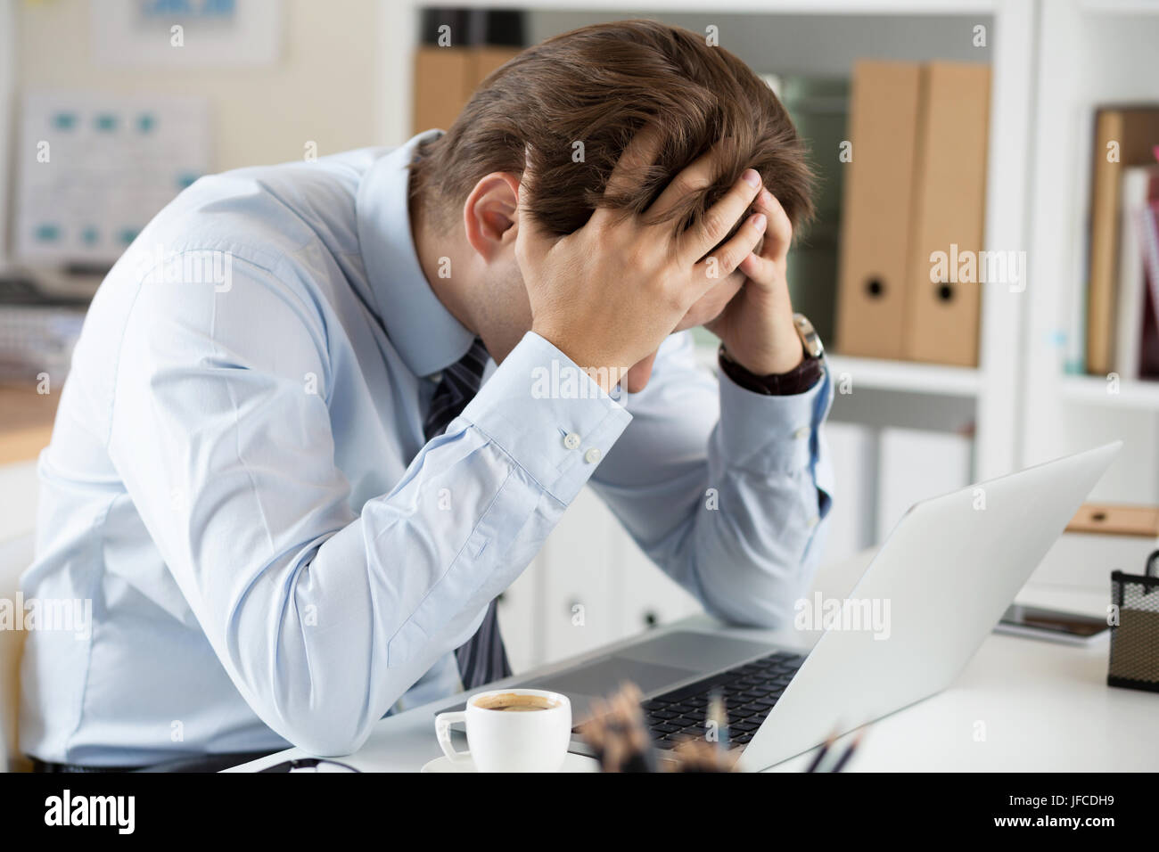 Man holding head in distress hi-res stock photography and images - Alamy