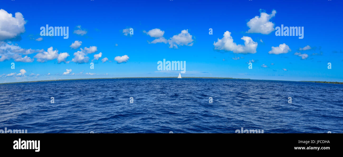 Caribbean sun on blue sky Stock Photo - Alamy