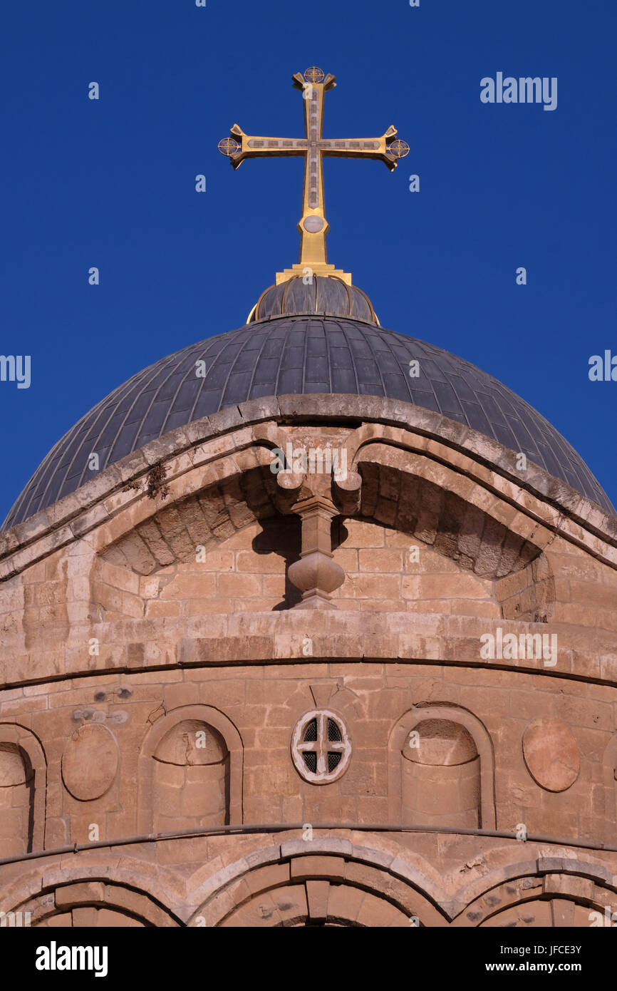 Cross over the silver gray dome of Church of Holy Sepulchre in the ...
