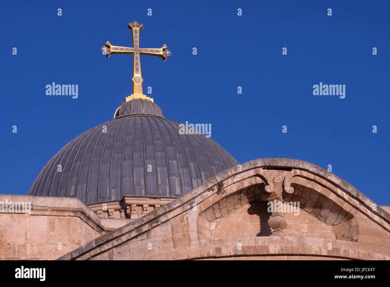 Cross over the silver gray dome of Church of Holy Sepulchre in the ...