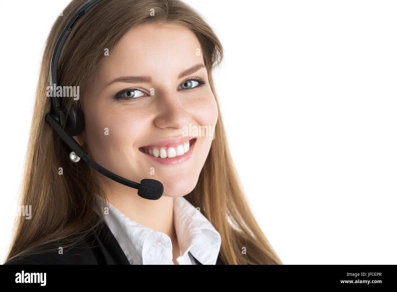 Portrait of young beautiful smiling call center worker talking to someone. Smiling customer ...